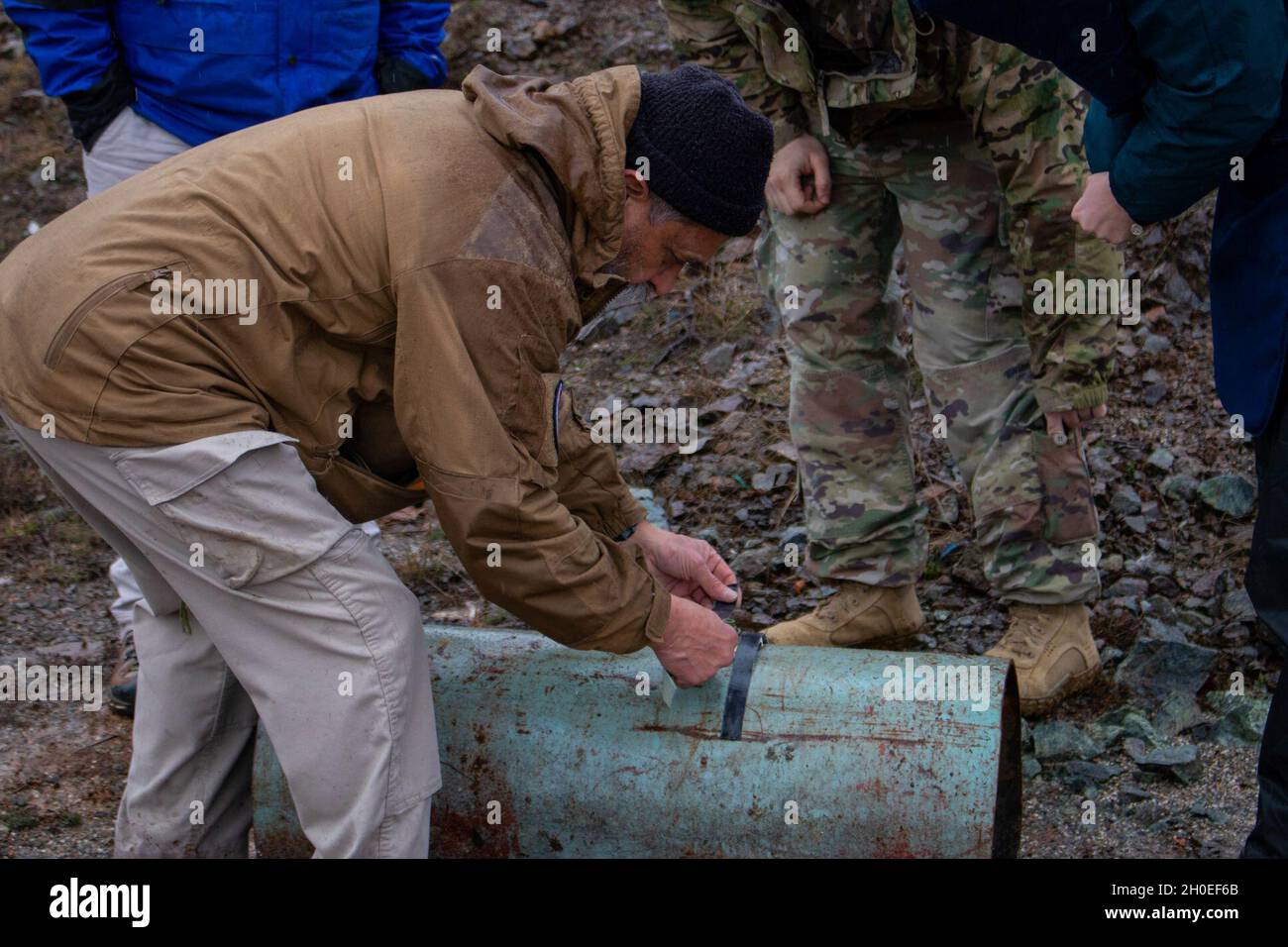 A member of Mine Action Training Kosovo places an explosive detonator ...