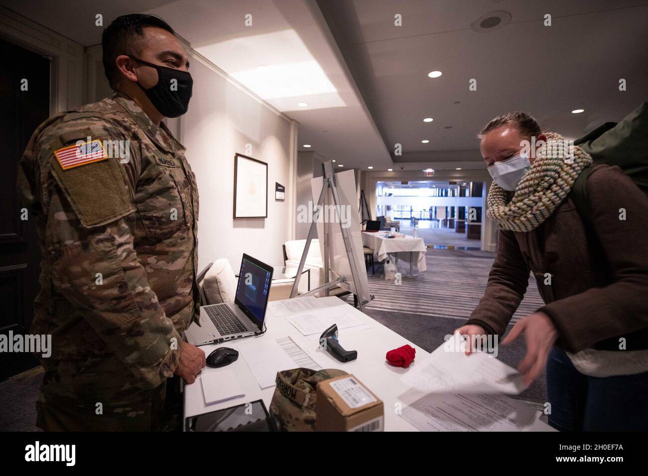 Army Spc. Anthony Moreno walks Navy Lt. Courtney Corcoran, assigned to ...