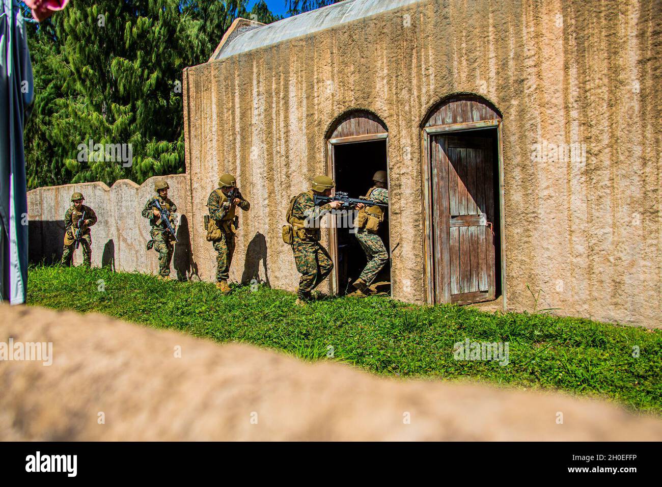 U.S. Marines with Charlie Company, 1st Battalion, 3d Marines, enter a ...