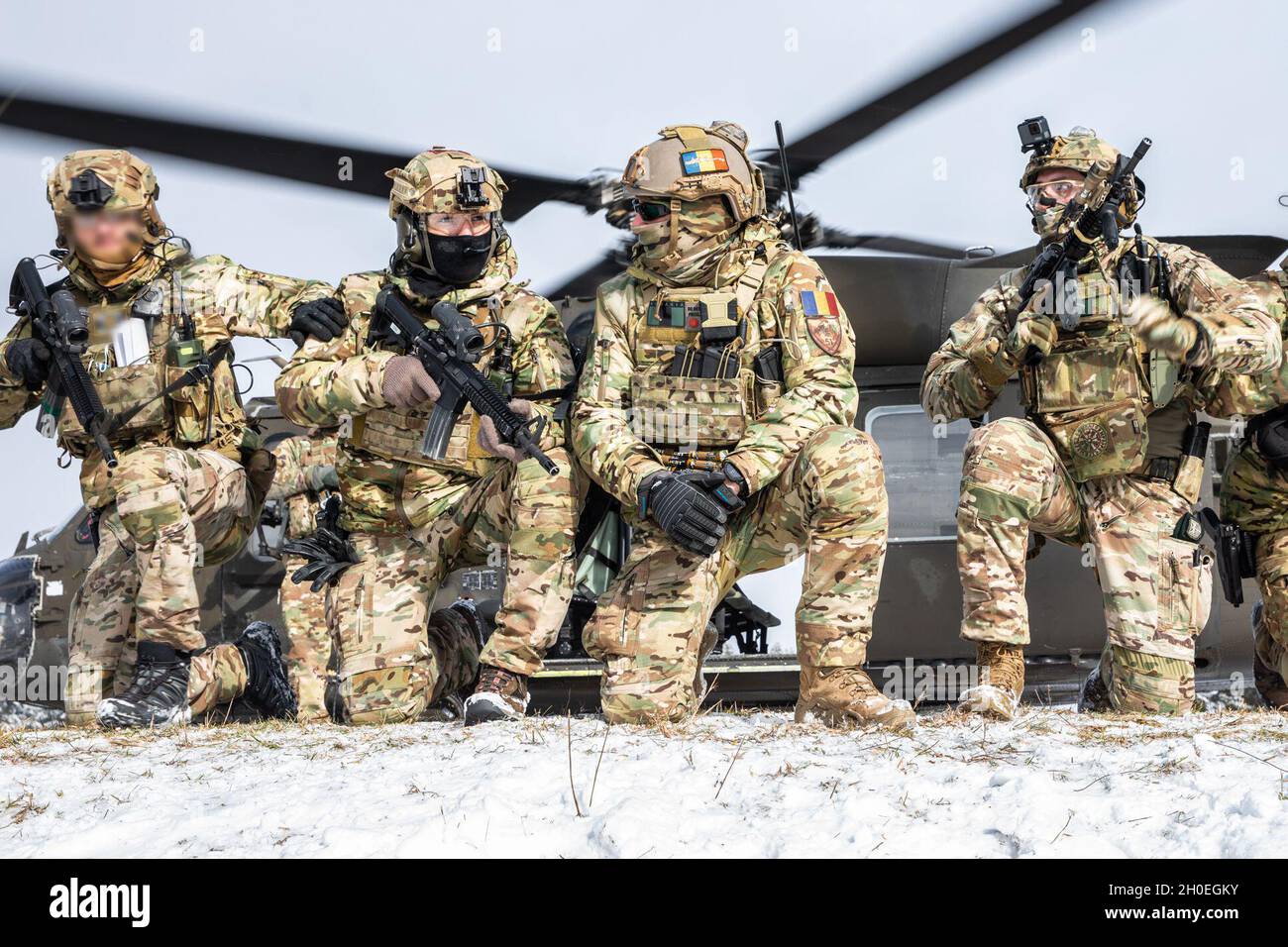 Romanian Special Forces pull security upon exiting a UH-60 Blackhawk ...