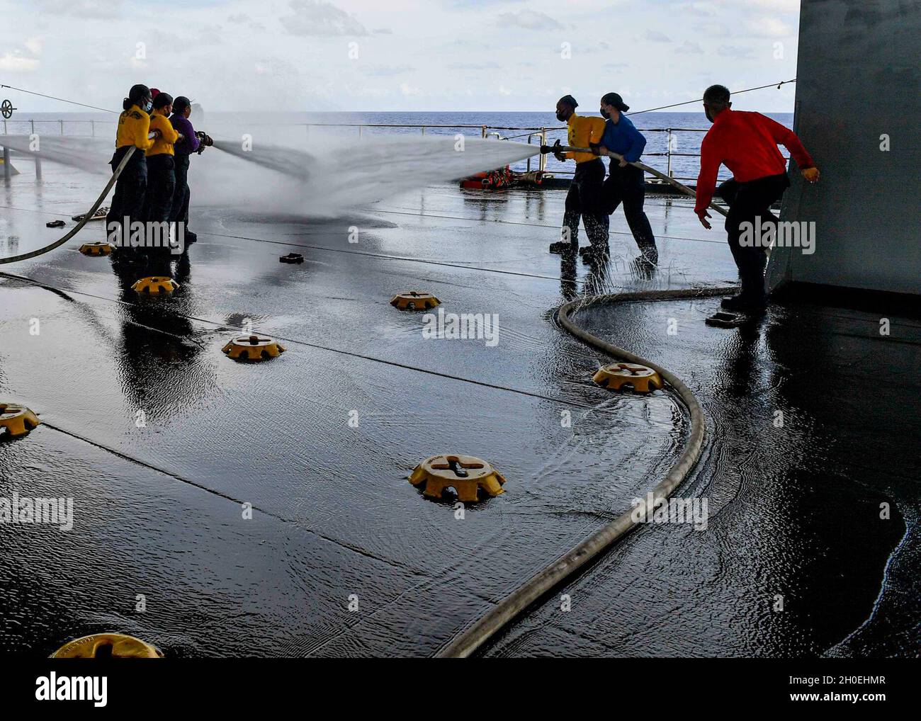 INDIAN OCEAN (Feb. 12, 2021) Sailors practice fire hose handling during ...