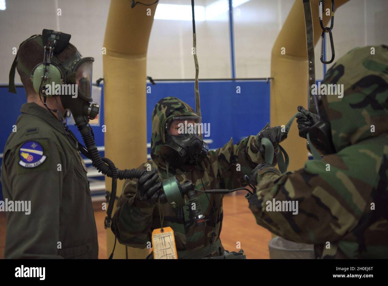U.S. Air Force service members practice the proper removal of Mission ...