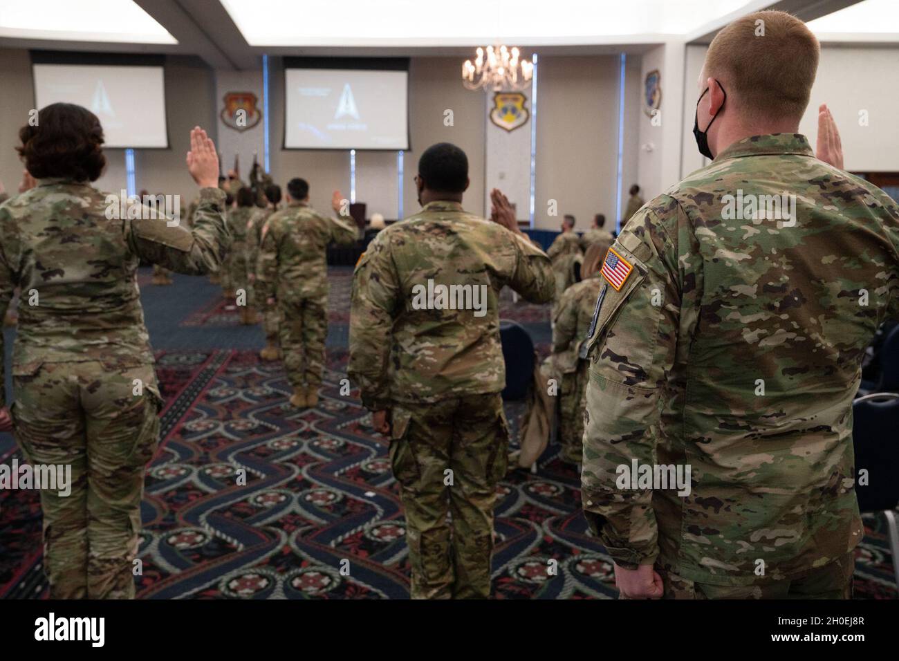 U.S. Space Force Guardians raise their right hands during an Oath of ...