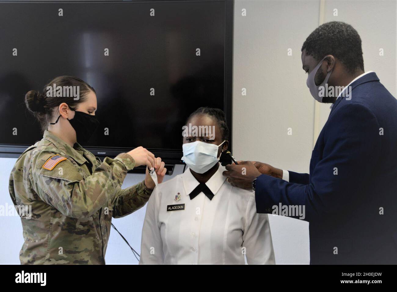 Capt. Victoria Aladeokin, then a 1st Lt., is promoted by her husband ...