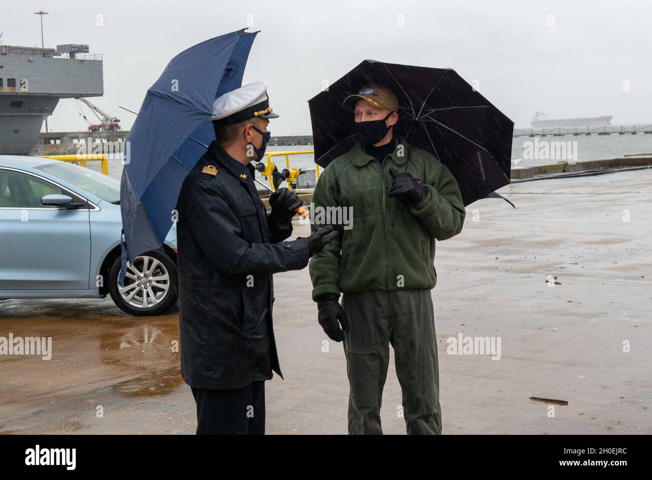 Italian Navy Capt. Gianfranco Vizzini, defense attaché, left, speaks ...