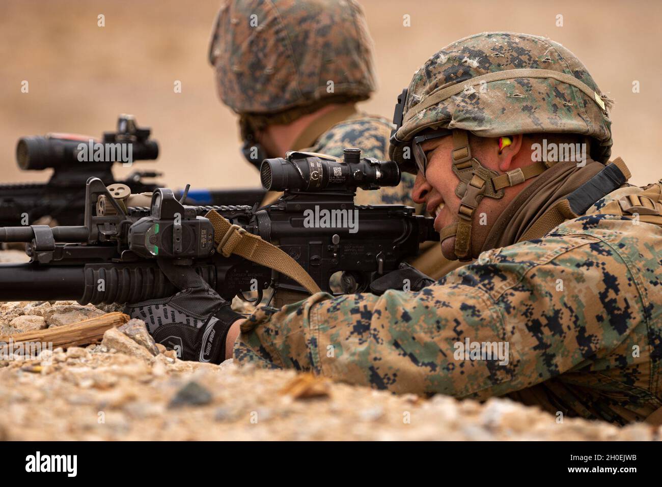A U.S. Marine with 2nd Battalion, 23rd Marines sights in on a marathon ...