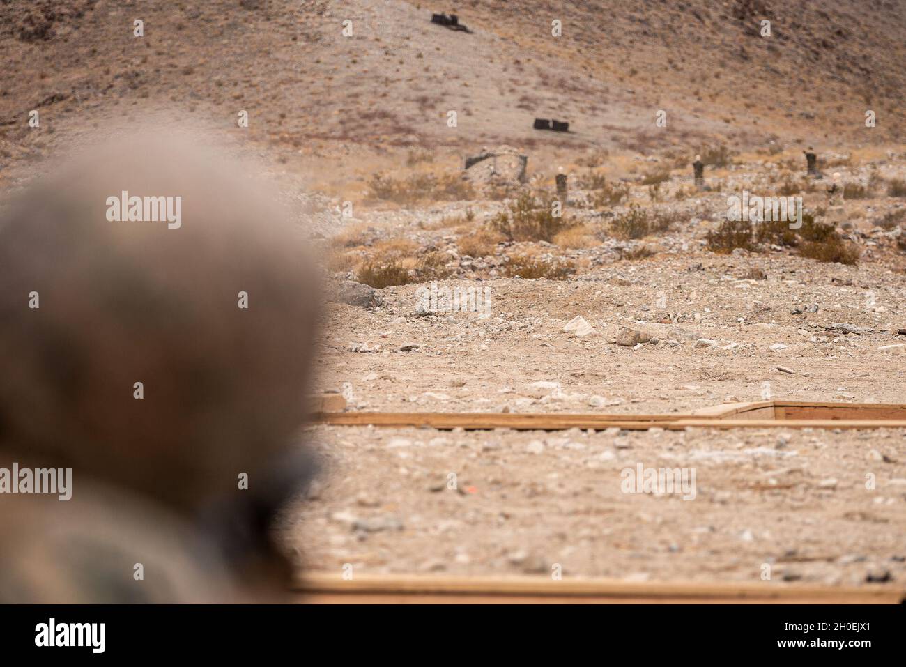 A U.S. Marine with 2nd Battalion, 23rd Marines engages a marathon ...