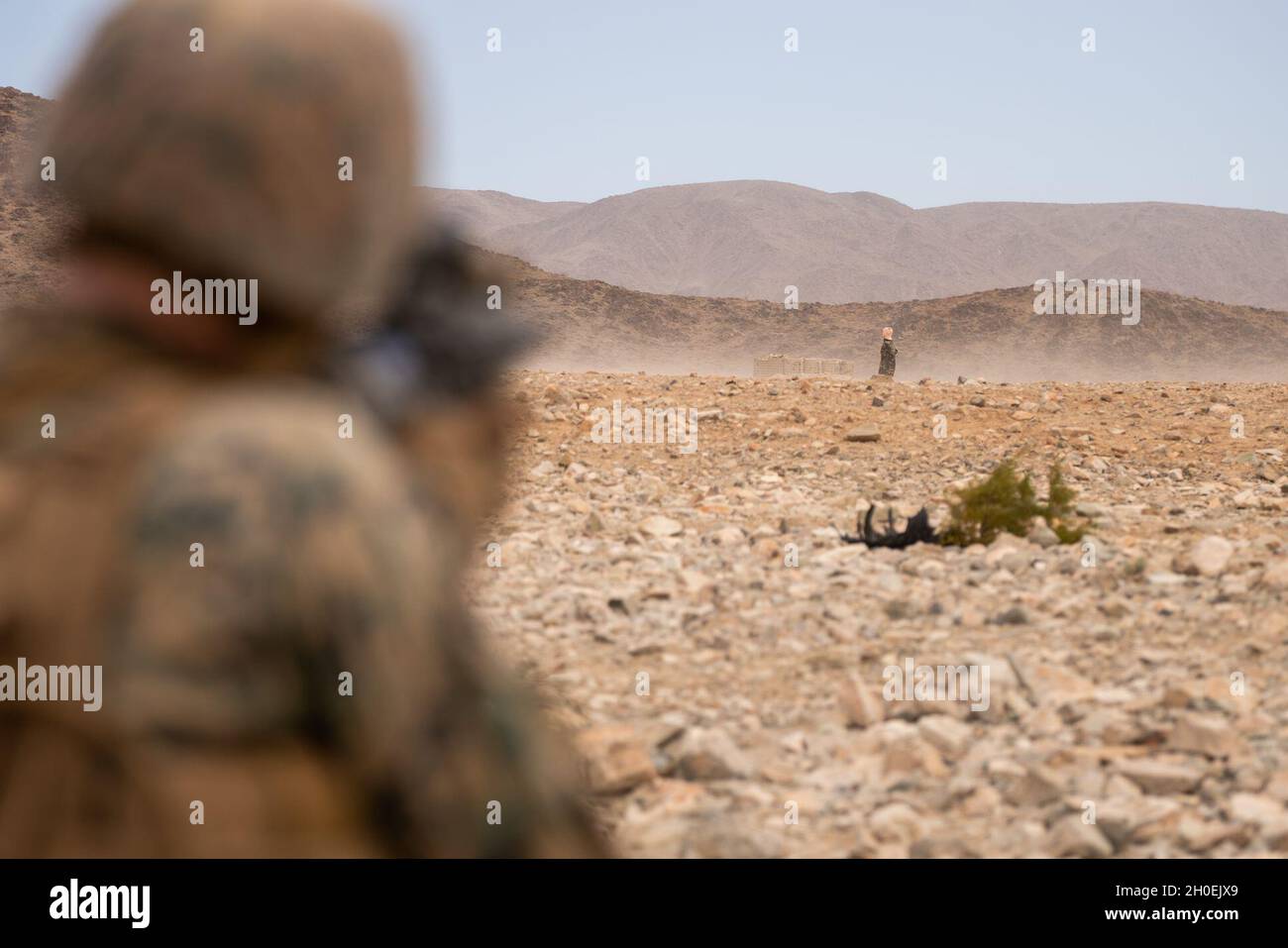 A U.S. Marine with 2nd Battalion, 23rd Marines engages a marathon ...
