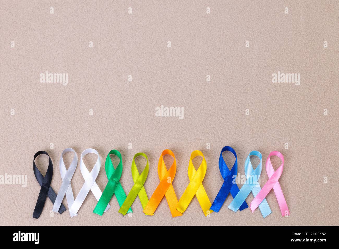 Colorful cancer ribbons isolated on cream background Stock Photo - Alamy
