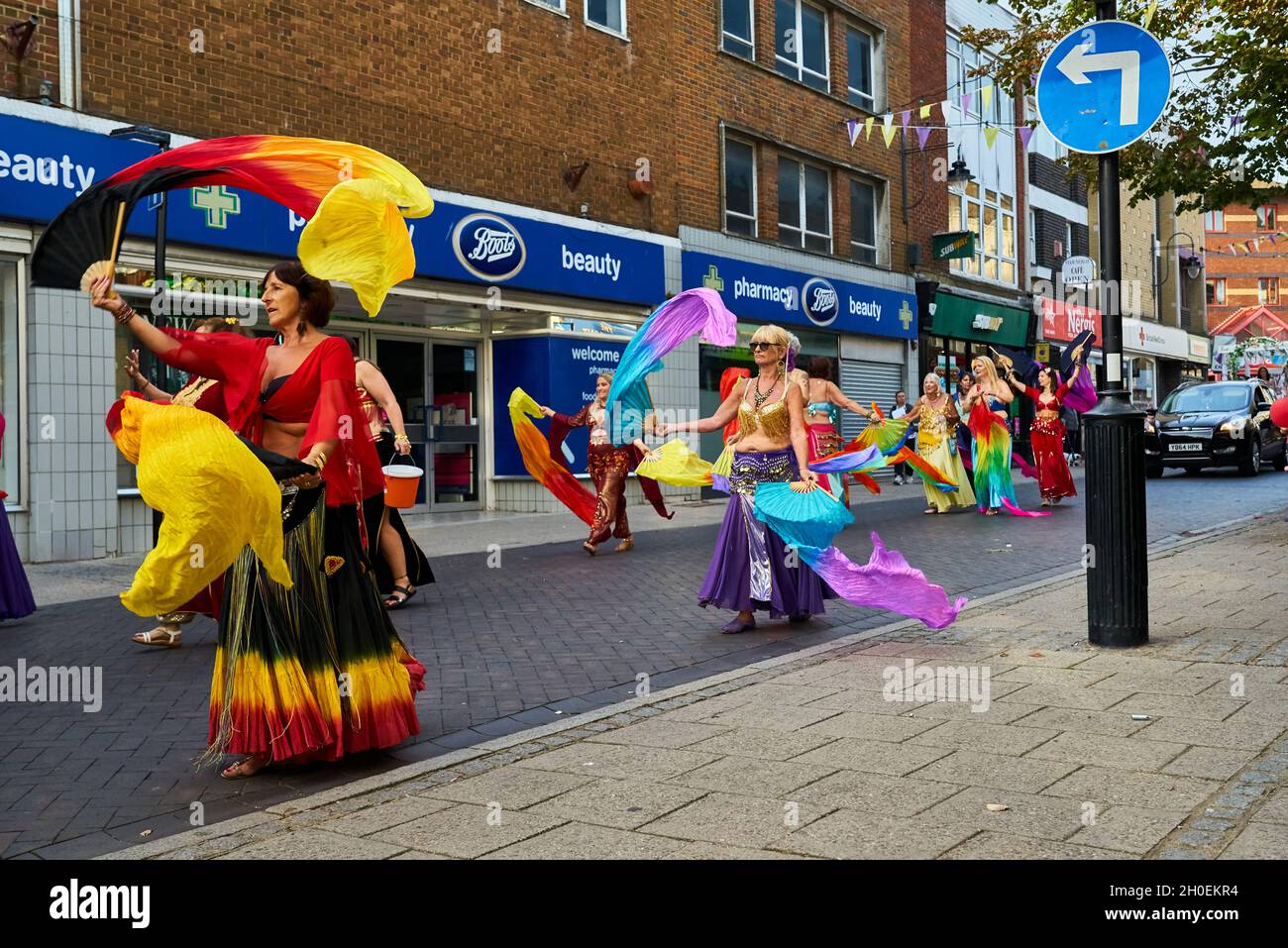 RAMSGATE, UNITED KINGDOM - Sep 12, 2021: The performers at Ramsgate Carnival running through the ...