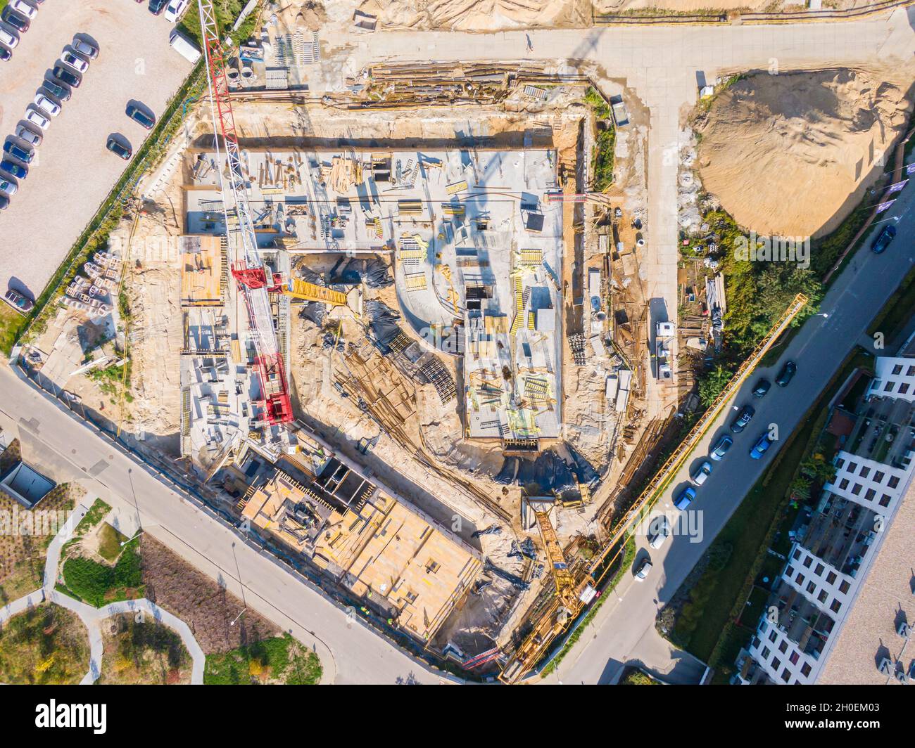 Residential building under construction. Cranes and other construction ...
