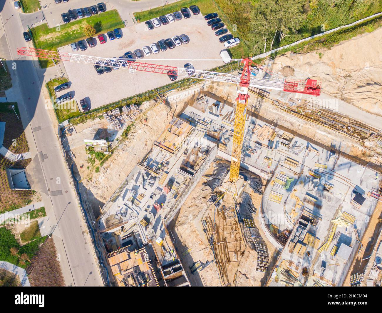 Residential building under construction. Cranes and other construction ...