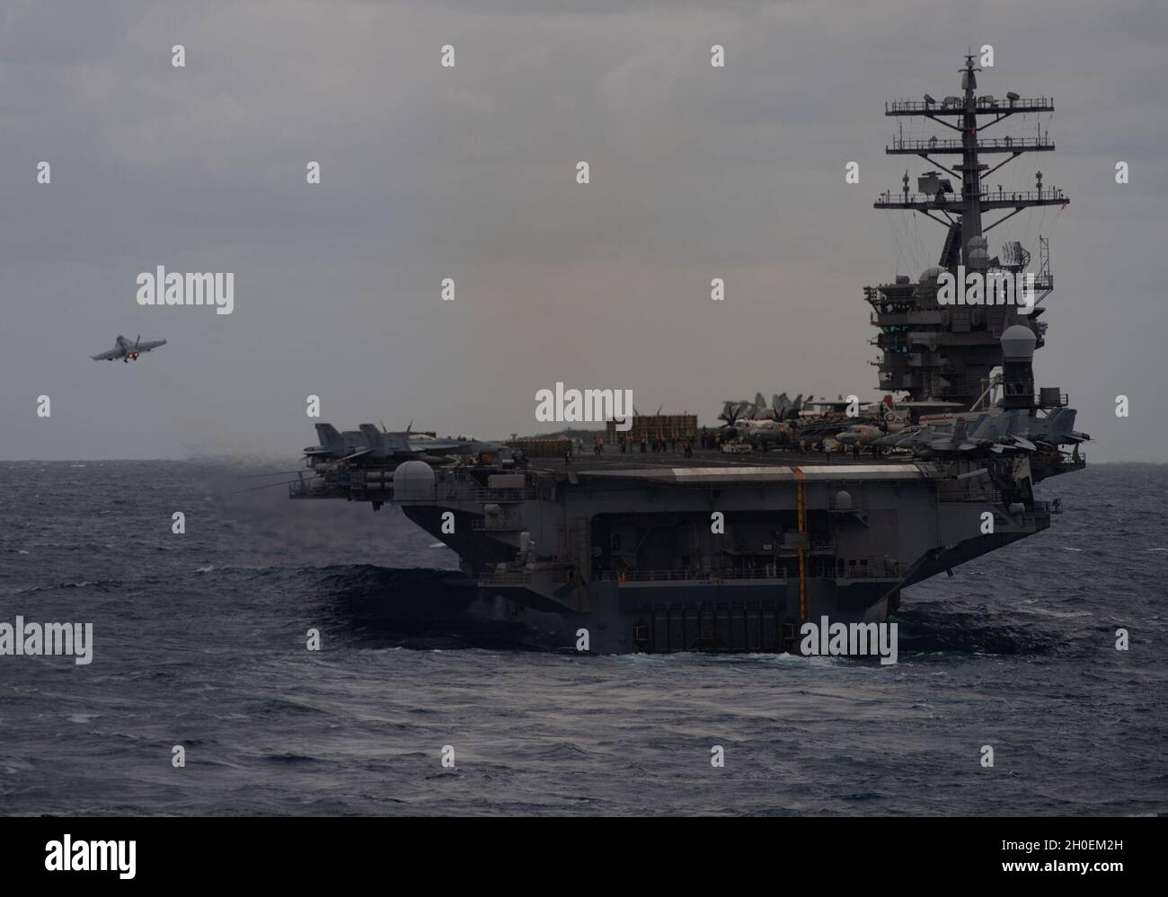 210215-N-OW019-0006 PACIFIC OCEAN (Feb. 15, 2021) An aircraft from ...