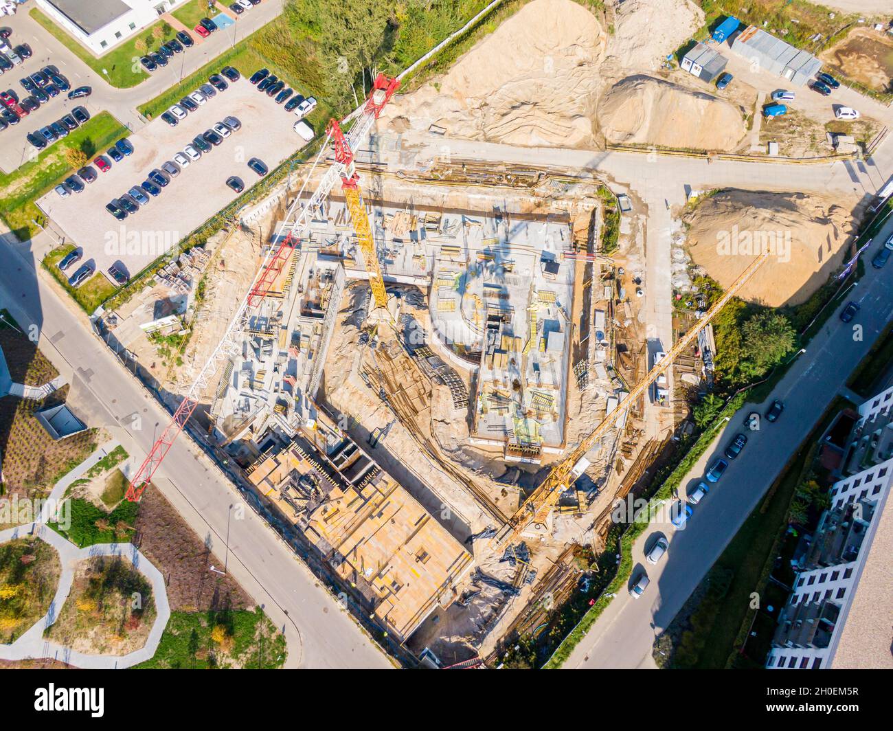 Residential building under construction. Cranes and other construction ...