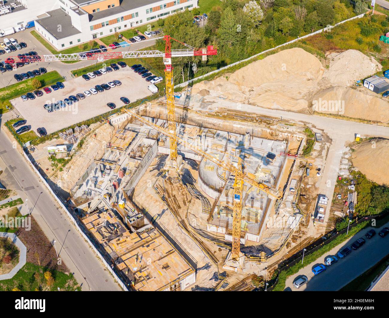 Residential building under construction. Cranes and other construction ...