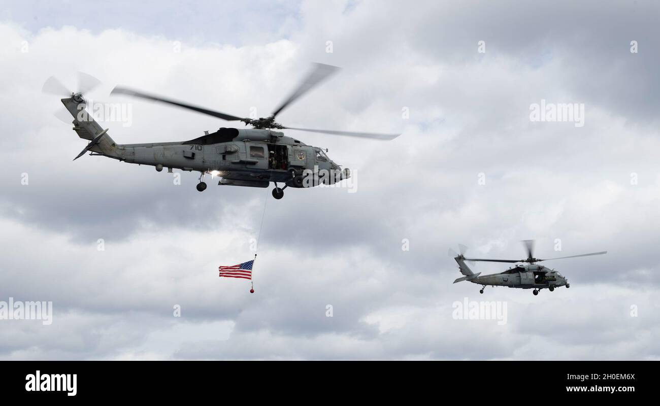 210215-N-DQ752-1324 PACIFIC OCEAN (Feb. 15, 2021) An MH-60R Sea Hawk ...