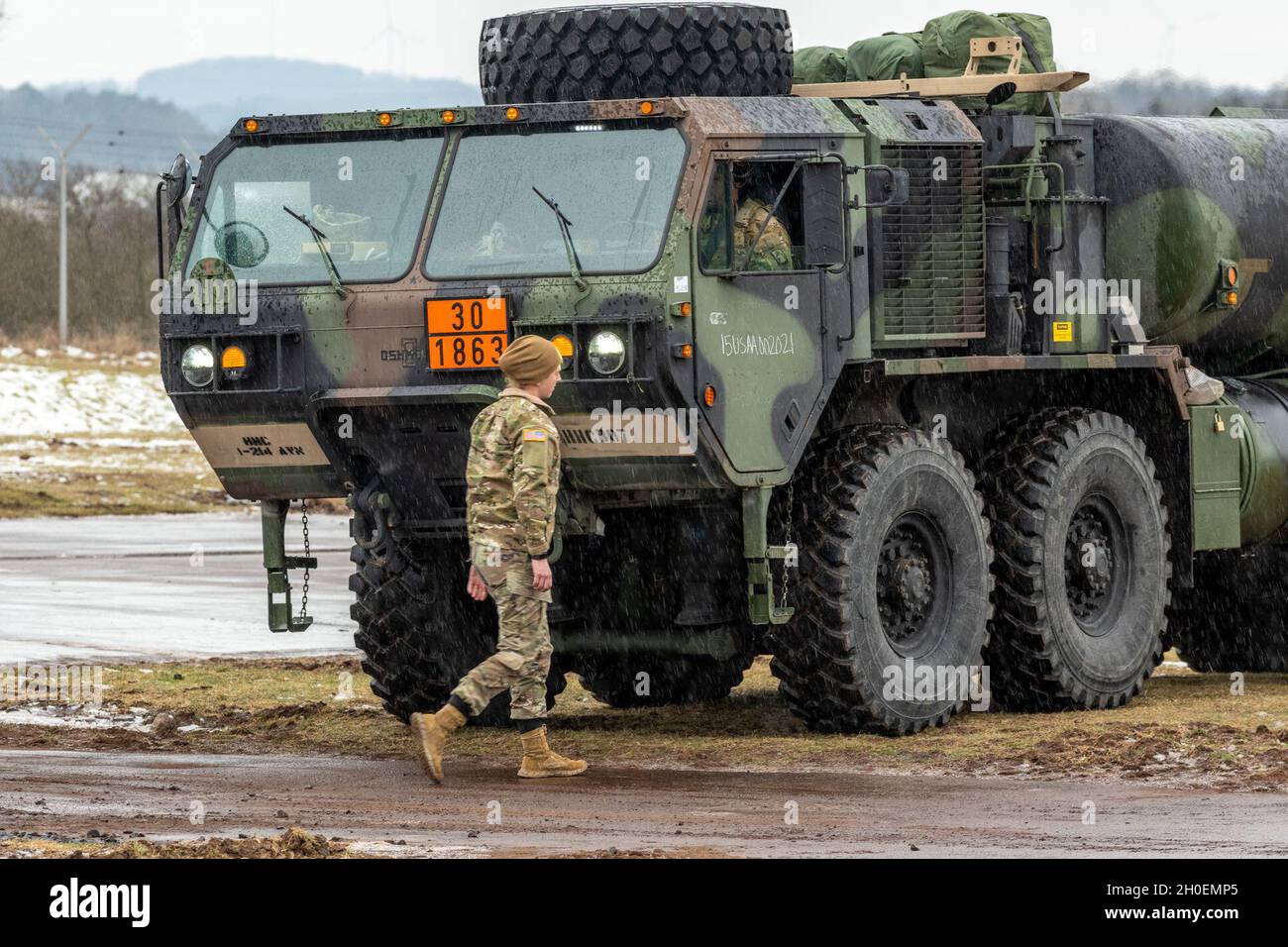 A convoy of support vehicles, assigned to 12th Combat Aviation Brigade ...