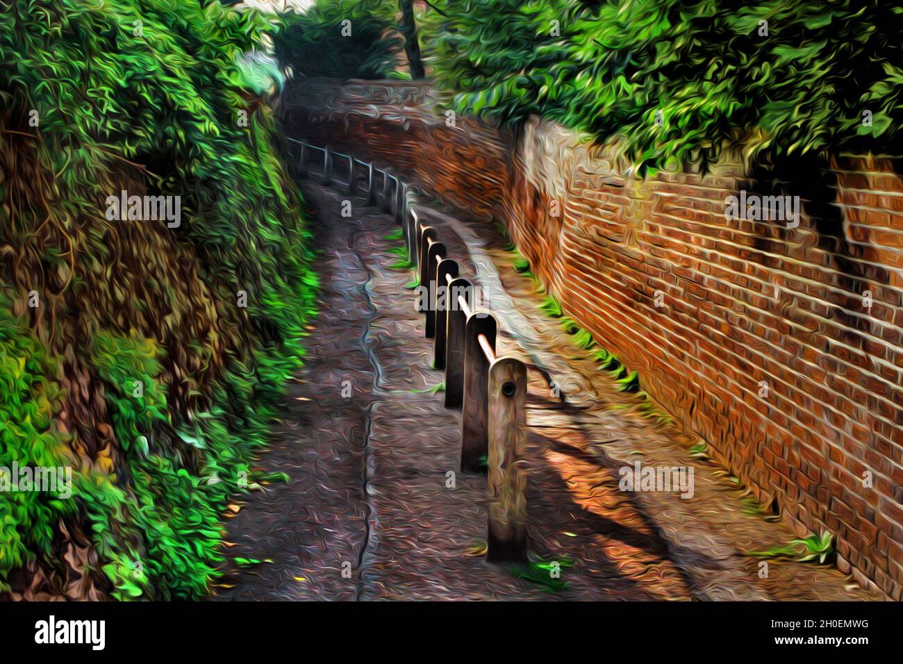 Narrow alley with brick wall and handrail in Oxford. A beautiful and ...