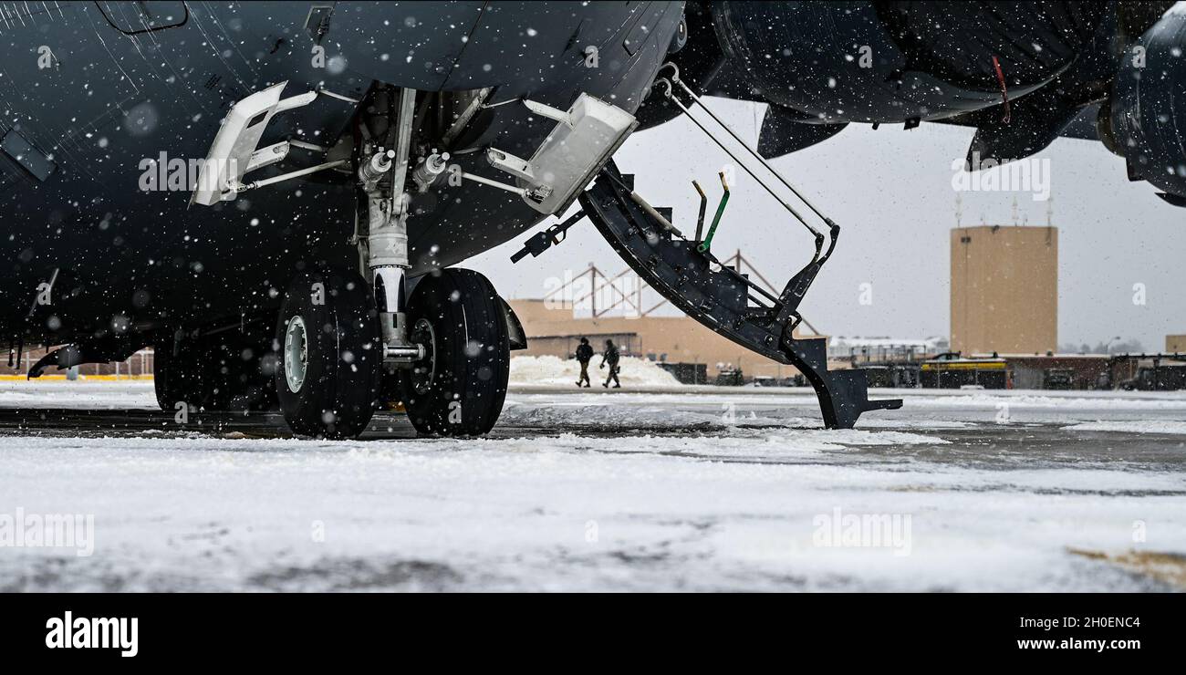 Airmen assigned to the 911th Aircraft Maintenance Squadron walk onto ...