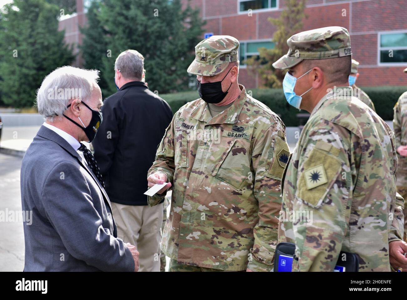 U.S. Army Brig. Gen. Jeffrey Smiley, center, the joint staff director ...