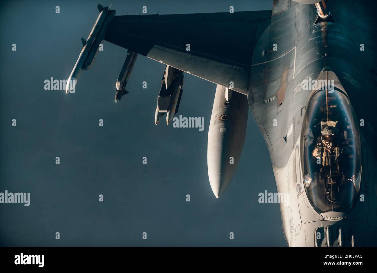 A U.S. Air Force F-16 Fighting Falcon aircraft receives fuel from a U.S ...