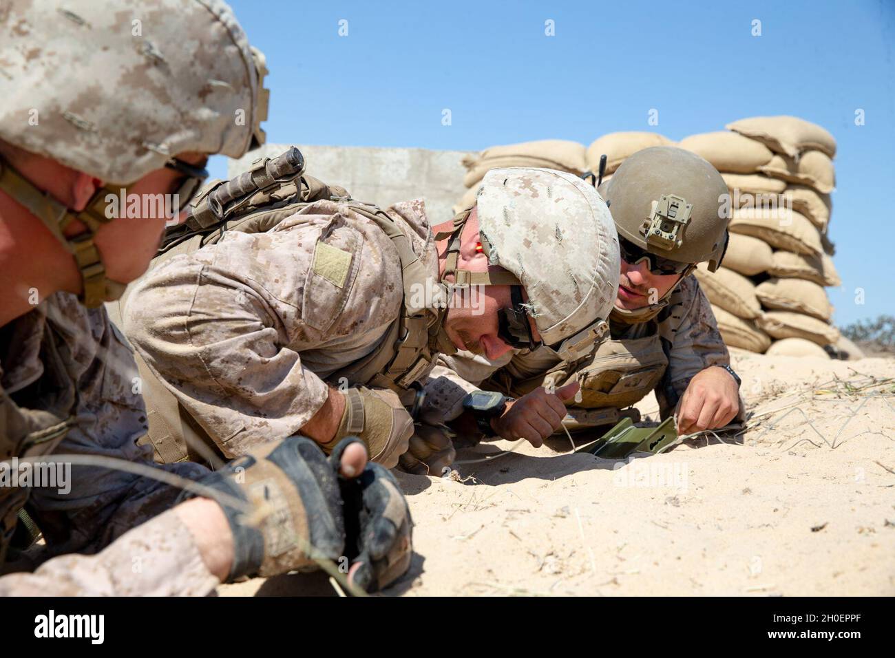 U.S. Marine Corps Cpl. Broderick Stephenson, center, a vehicle ...
