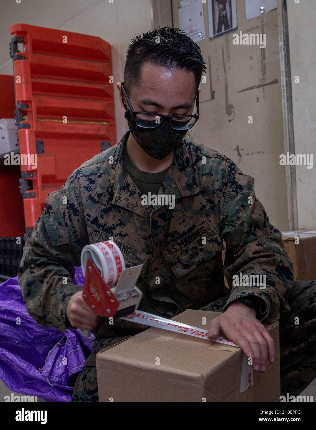 U.S. Marine Corps Cpl. Ekin Vang, a postal clerk with Camp Foster Post ...