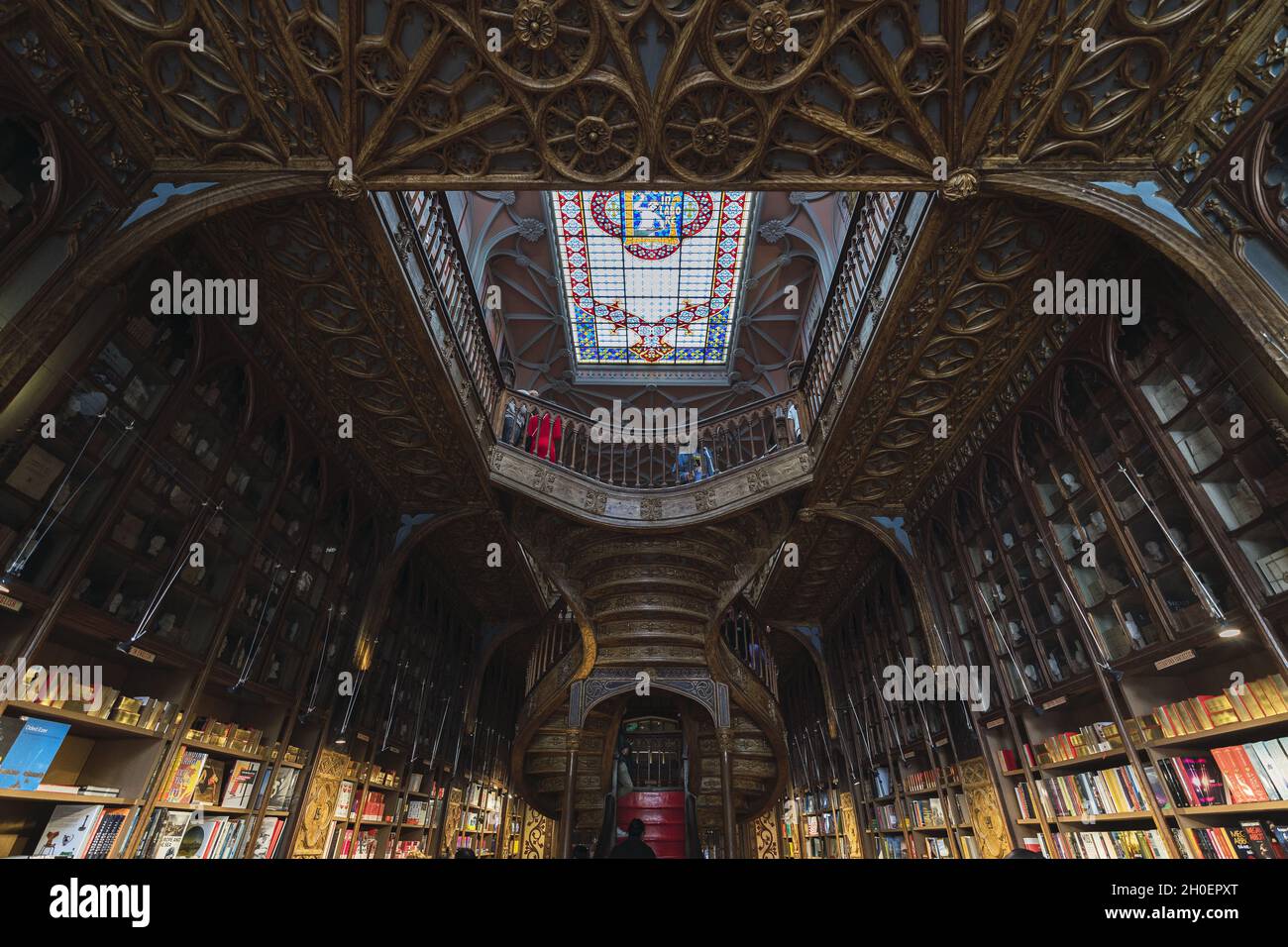 Interior view of a library with thousands of books arranged on shelves ...
