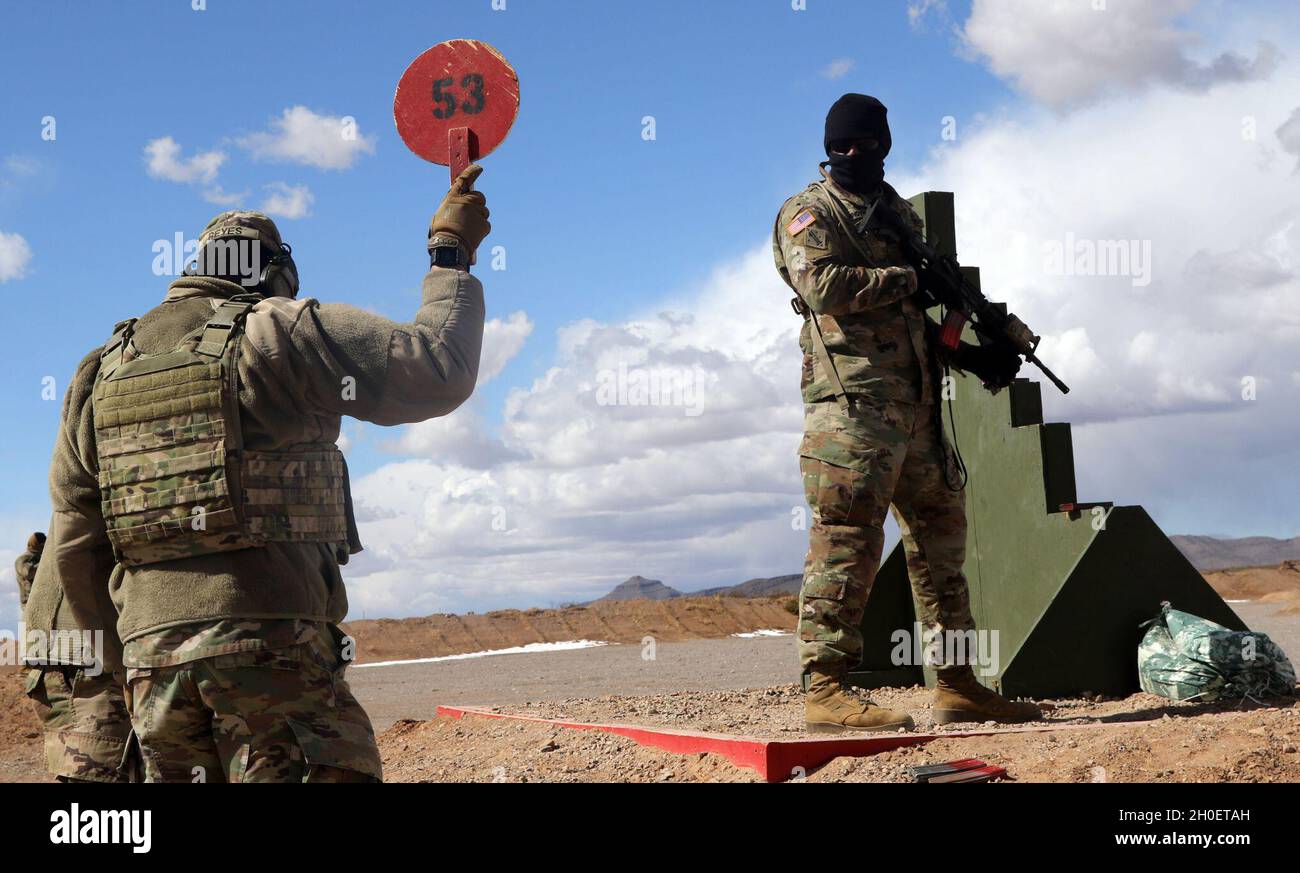 An observer, coach/ trainer assigned to Task Force Mountain Warrior ...
