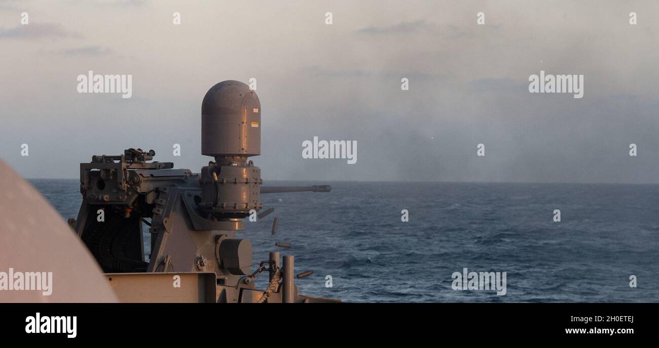 210217-N-RO680-4063 PACIFIC OCEAN (Feb. 17, 2021) A Mark 38 machine gun ...