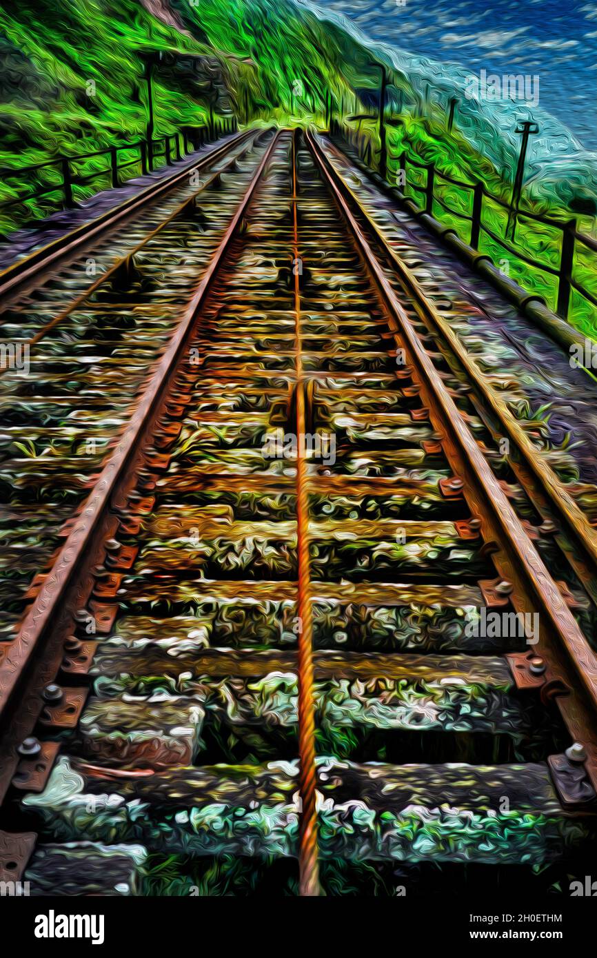 Train tracks of an old disused railway line over a bridge in the ...