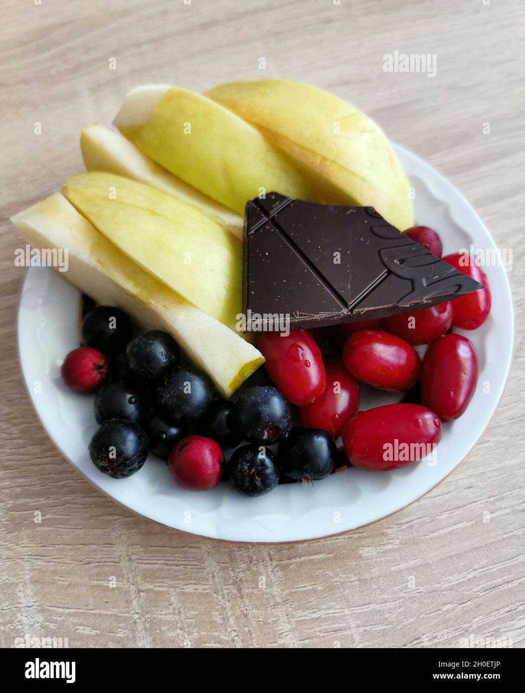 Colorful berries and a piece of dark chocolate are the best ...
