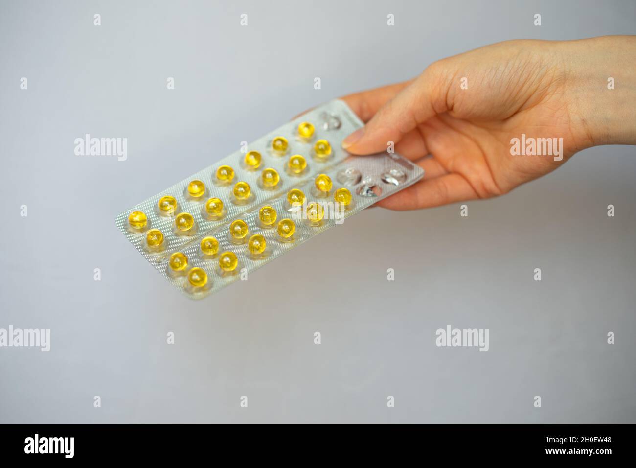 Yellow small round complex of vitamins and minerals in a blister pack ...
