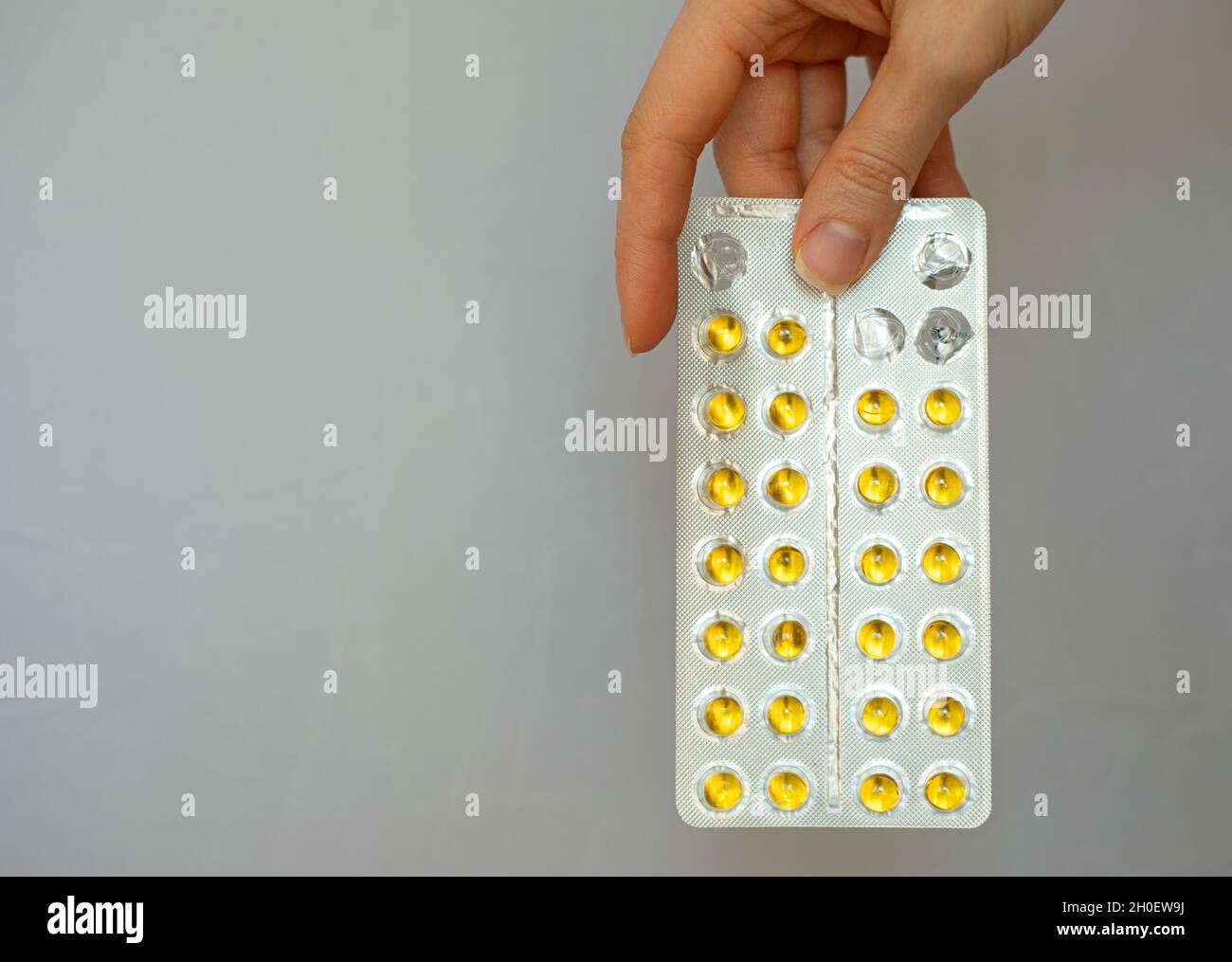 Yellow small round complex of vitamins and minerals in a blister pack ...