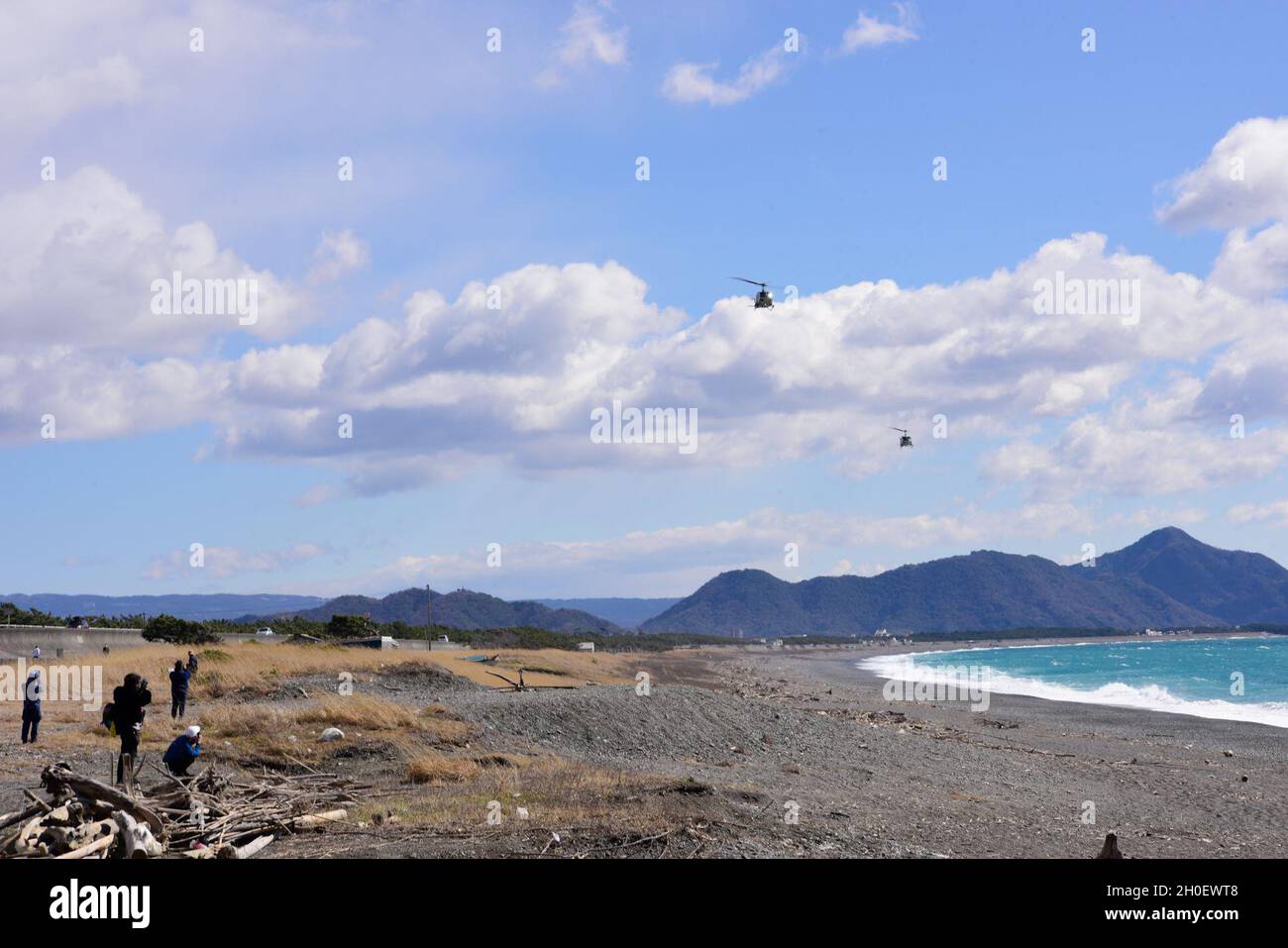 Two UH1N helicopters, assigned to the 459th Airlift Squadron, fly over ...