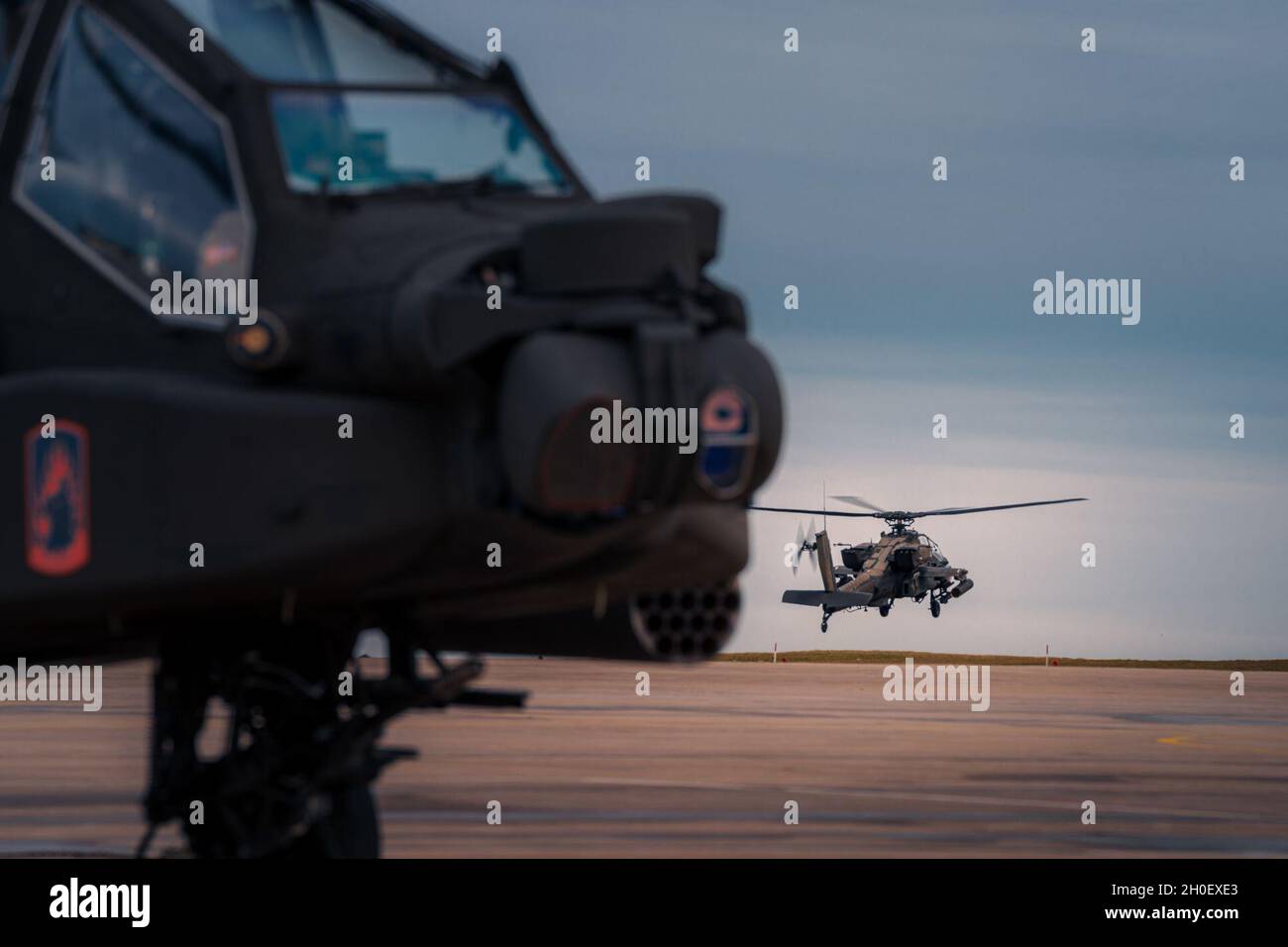 An AH-64 Apache attack helicopter of the 12th Combat Aviation Brigade ...