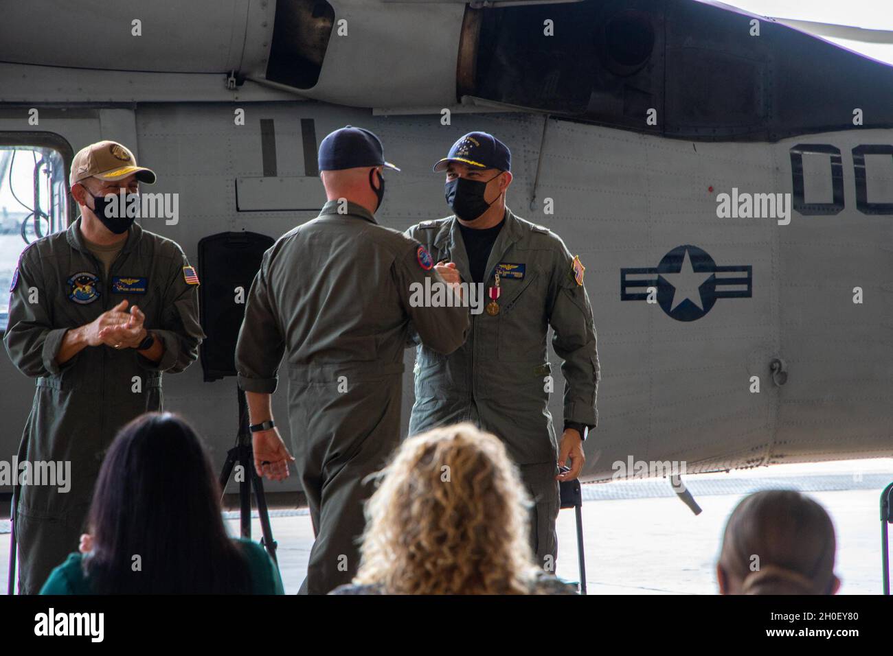 Cdr. Chris Carreon and Cdr. Butts exchange congratulations following ...