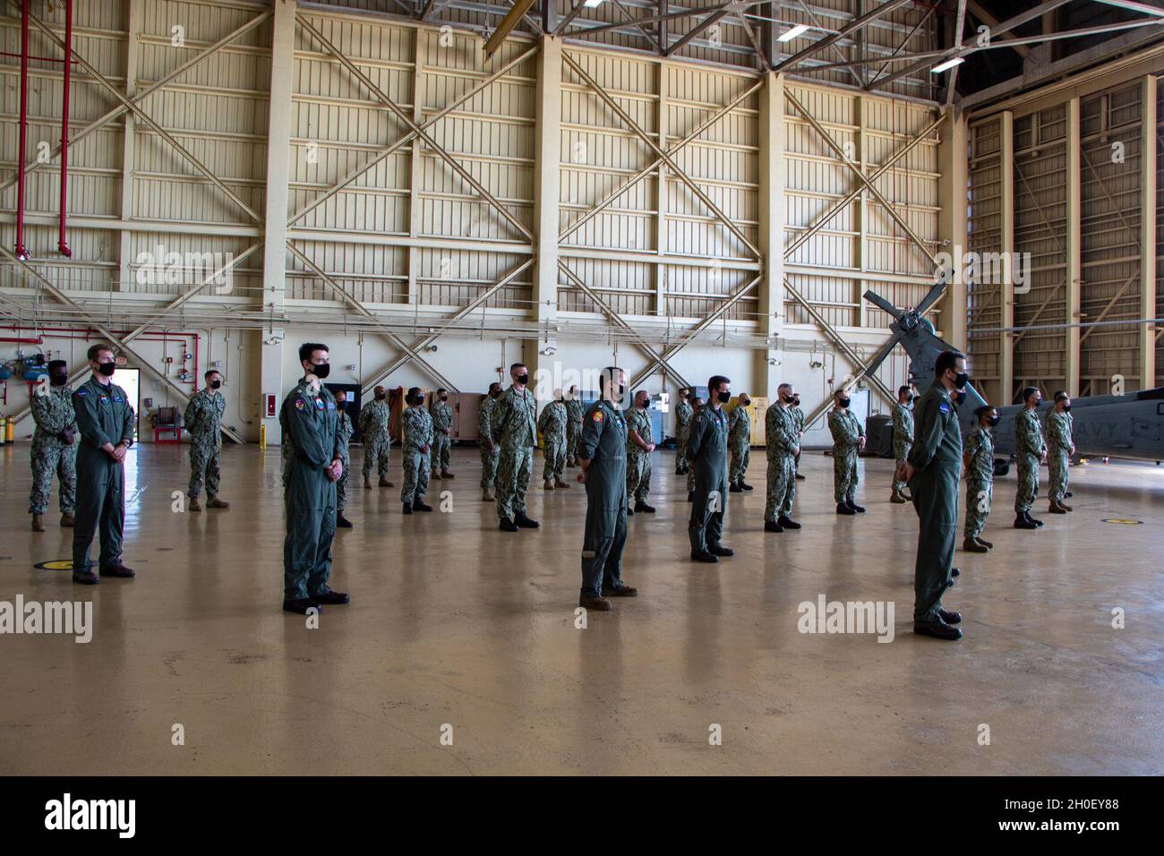 Sailors attached to Helicopter Combat Squadron (HSC) 25 stand in ...
