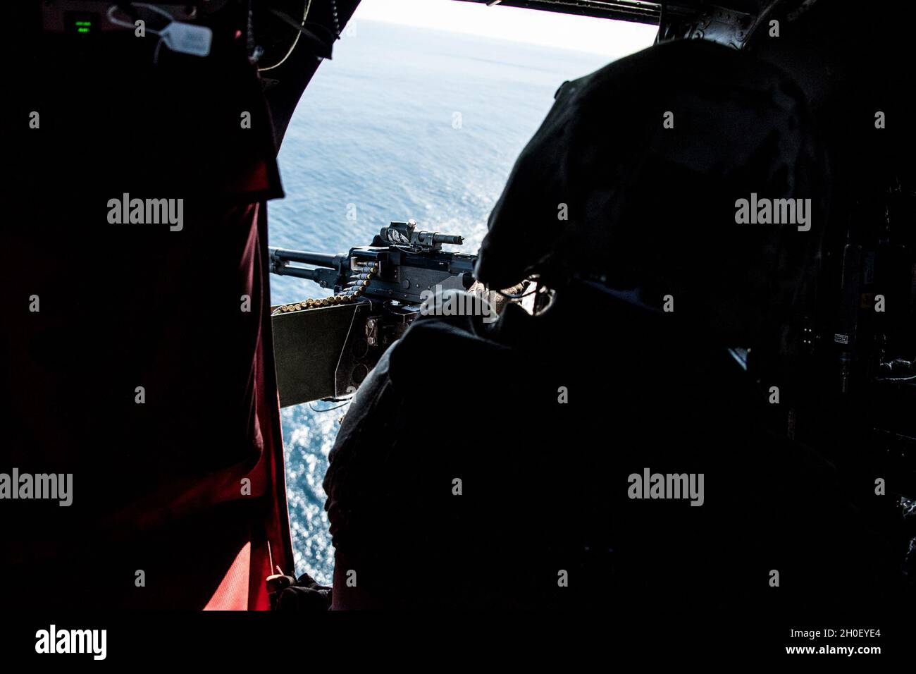 A U.S. Navy Sailor from Helicopter Sea Combat Squadron 85 performs live ...