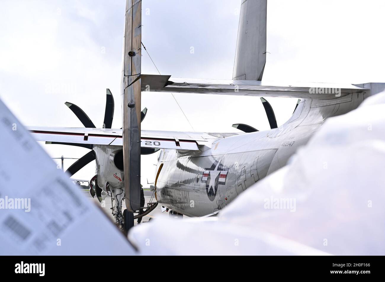 210219-N-TA290-1009 PEARL HARBOR (February 19, 2021) A C-2A aircraft awaiting onboard of high ...