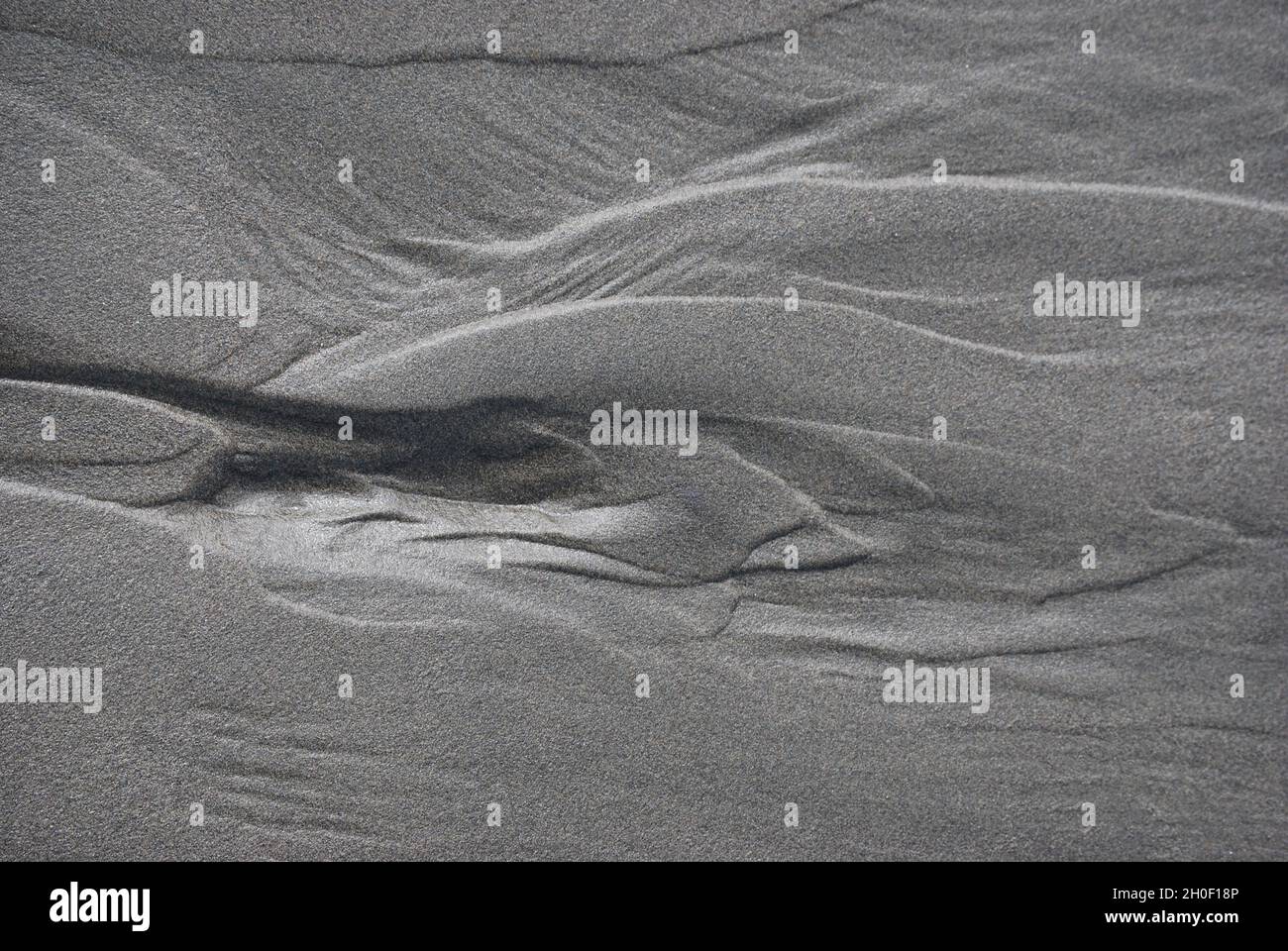 Swirls in the sand closeup Stock Photo - Alamy