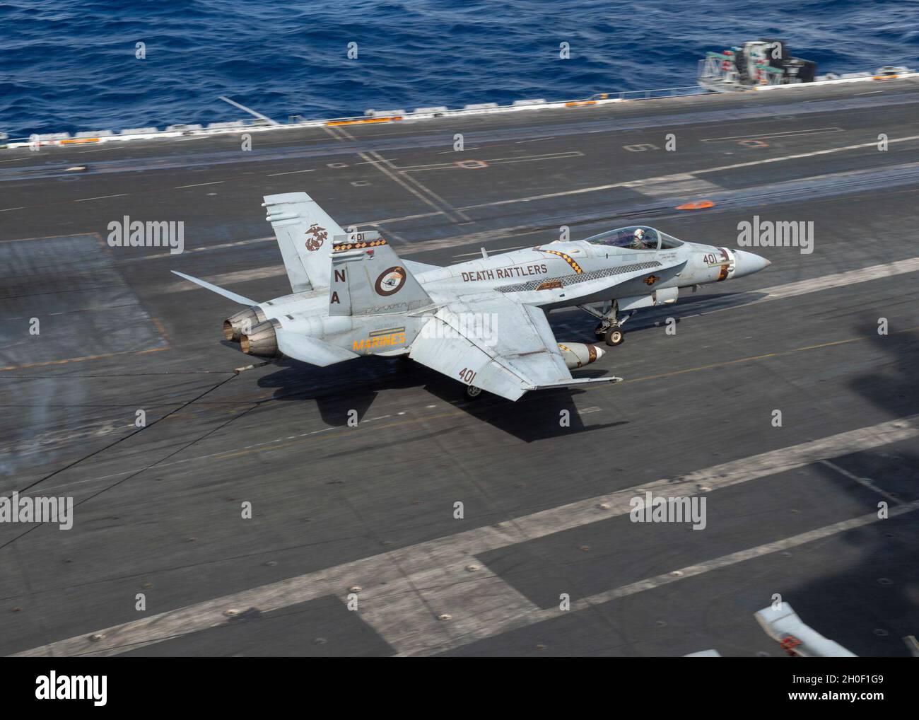 210219-N-KO930-1244 PACIFIC OCEAN (Feb. 19, 2021) An F/A-18C Hornet ...