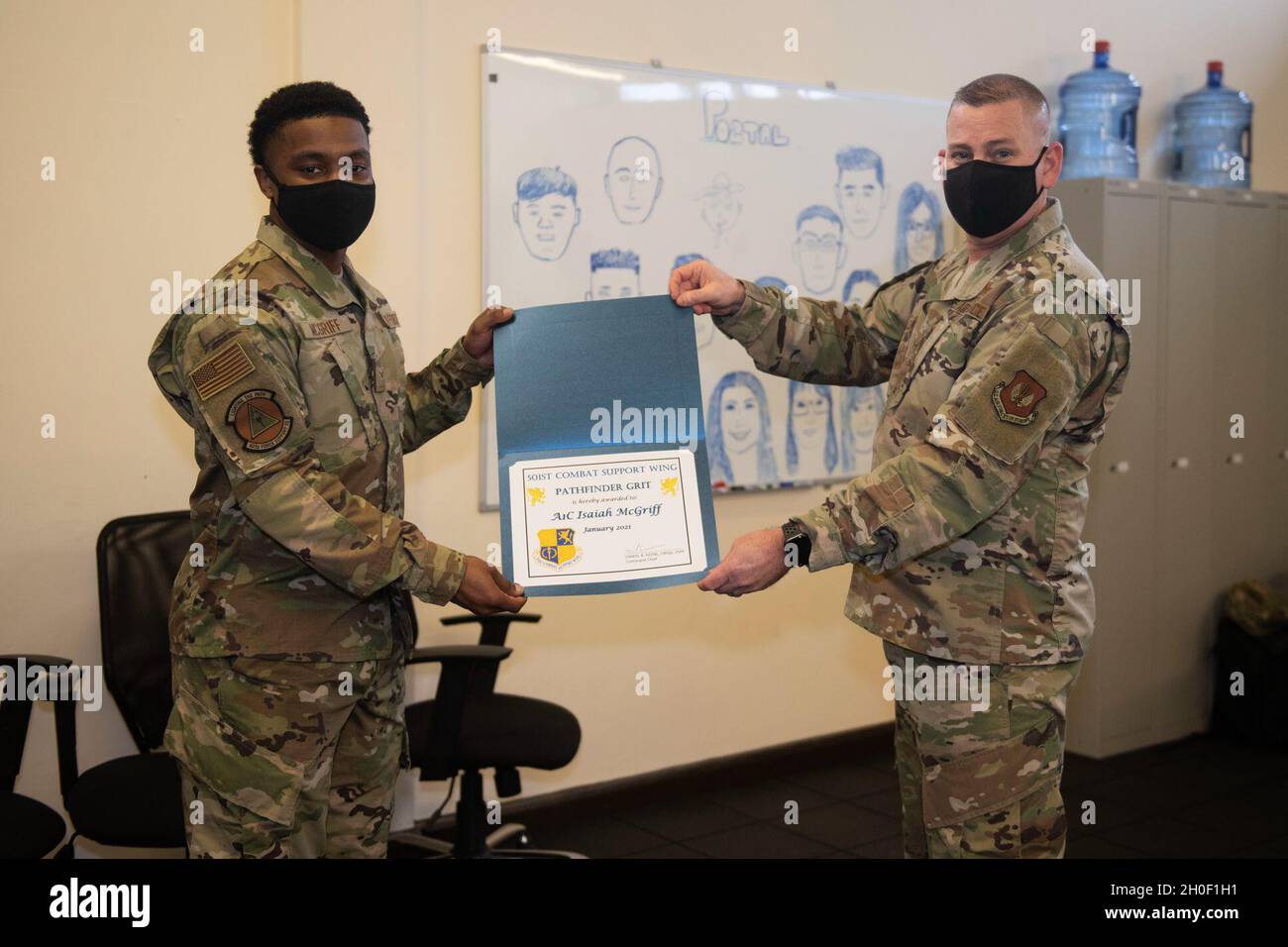 U.S. Air Force Airman 1st Class Isaiah McGriff, left, 423rd Force ...