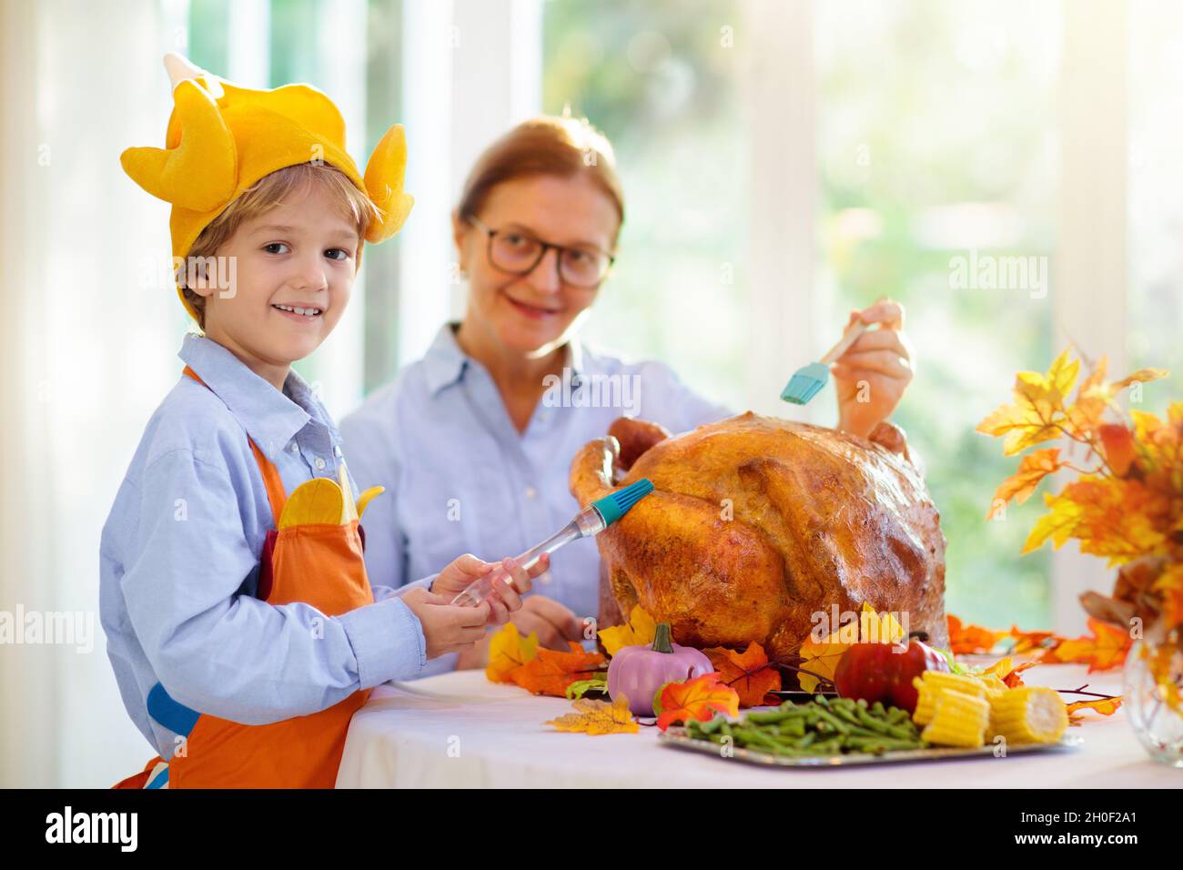 Turkey for Thanksgiving. Family cooking festive dinner. Grandmother and ...