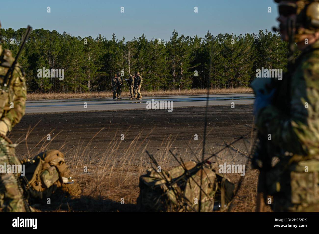 U.S. Air Force Special Tactics operators review airfield assessment ...
