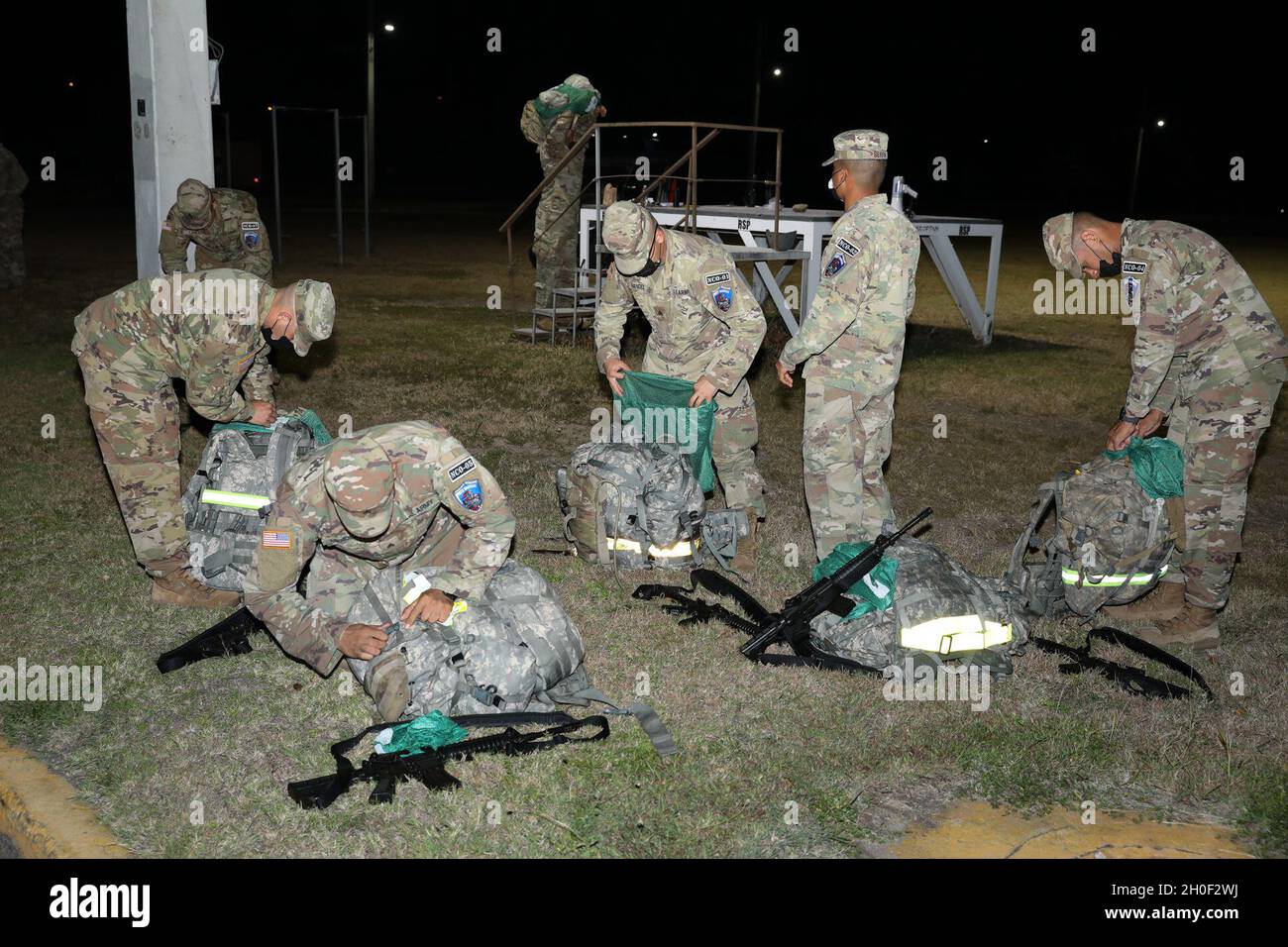 The Puerto Rico Army National Guard soldiers inspect their rucksacks ...