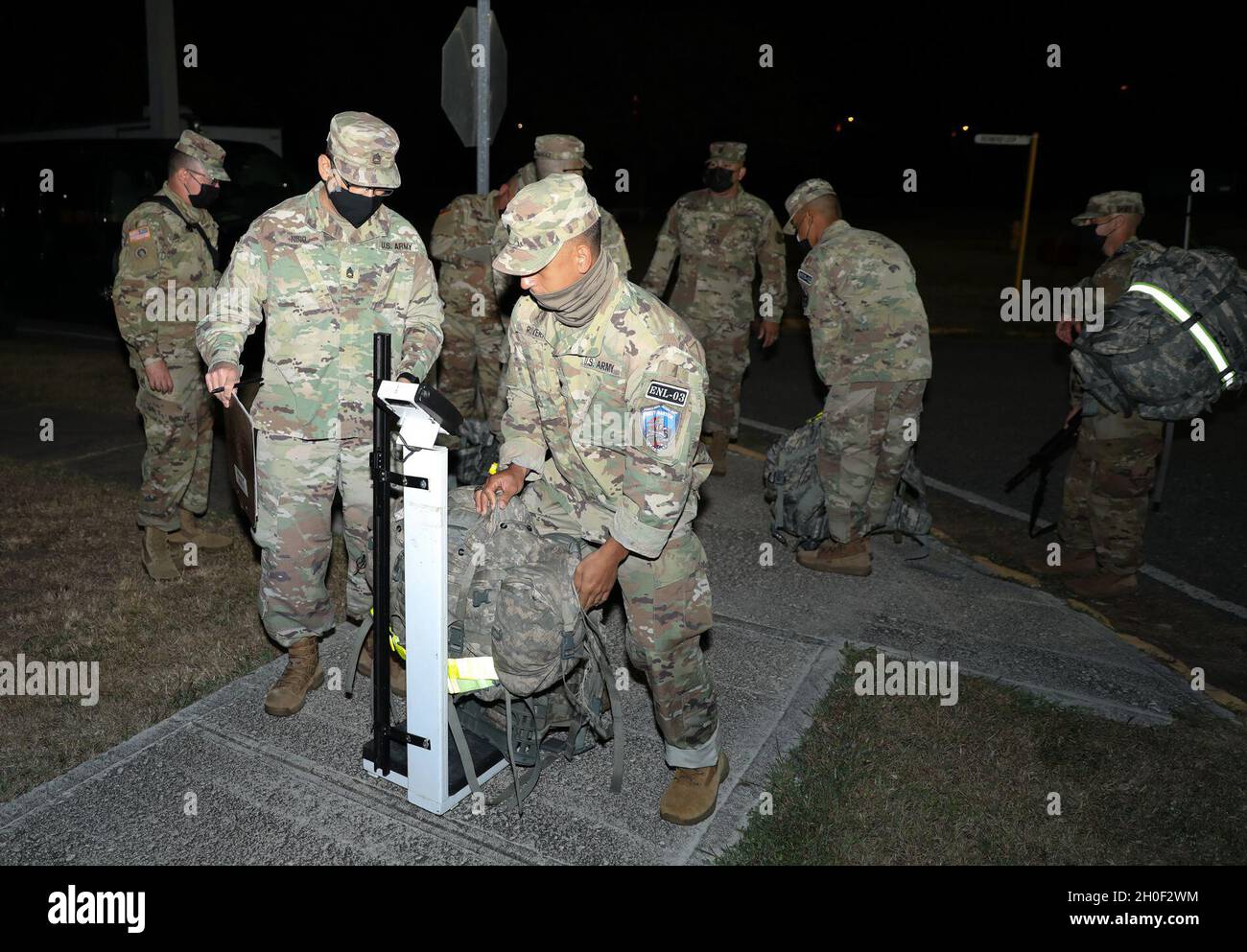 The Puerto Rico Army National Guard soldiers weigh their rucksacks ...