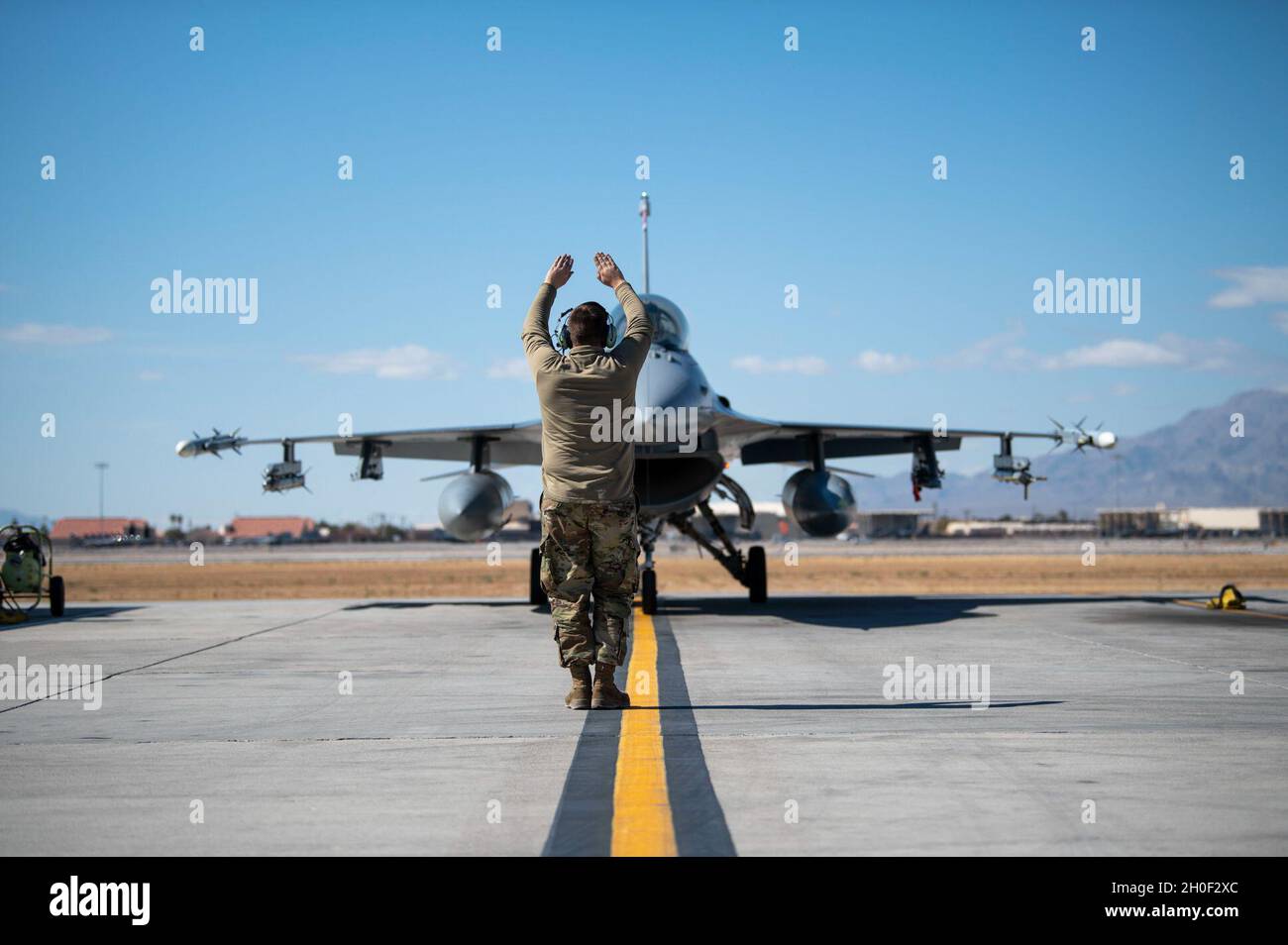 U.S. Air Force Airman 1st Class Mark Raasch, a crew chief assigned to ...