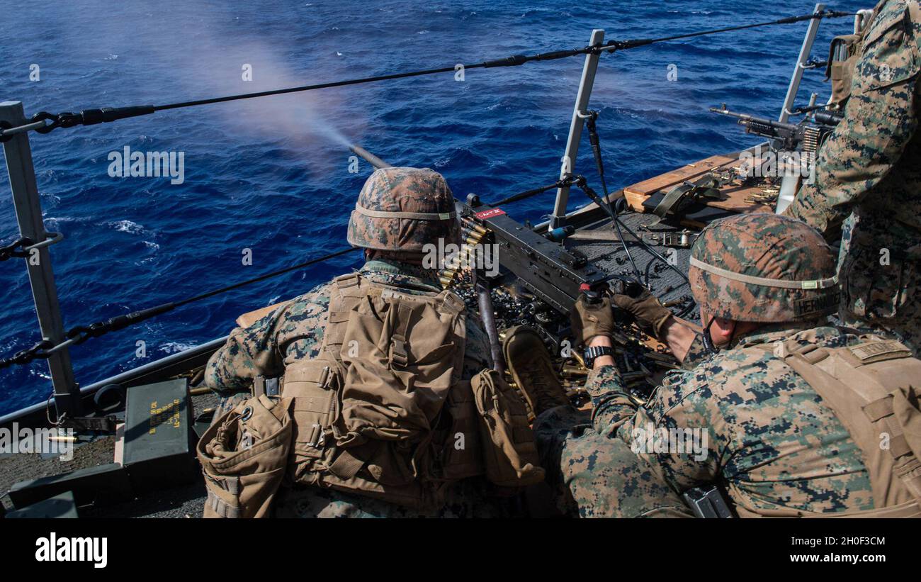 PHILIPPINE SEA (Feb. 20, 2021) Marine machine gun teams fire 50-cal and ...