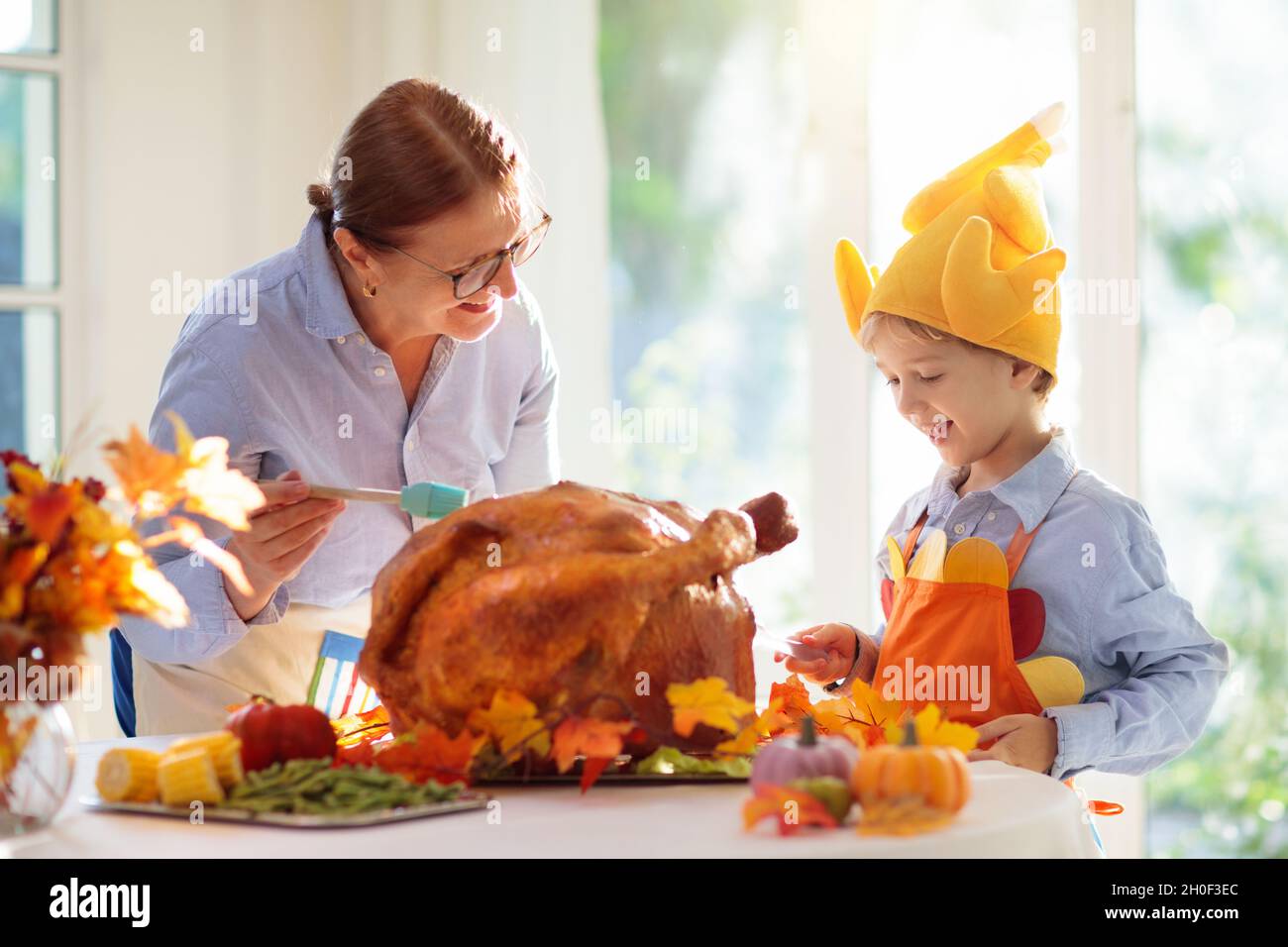 Turkey for Thanksgiving. Family cooking festive dinner. Grandmother and ...